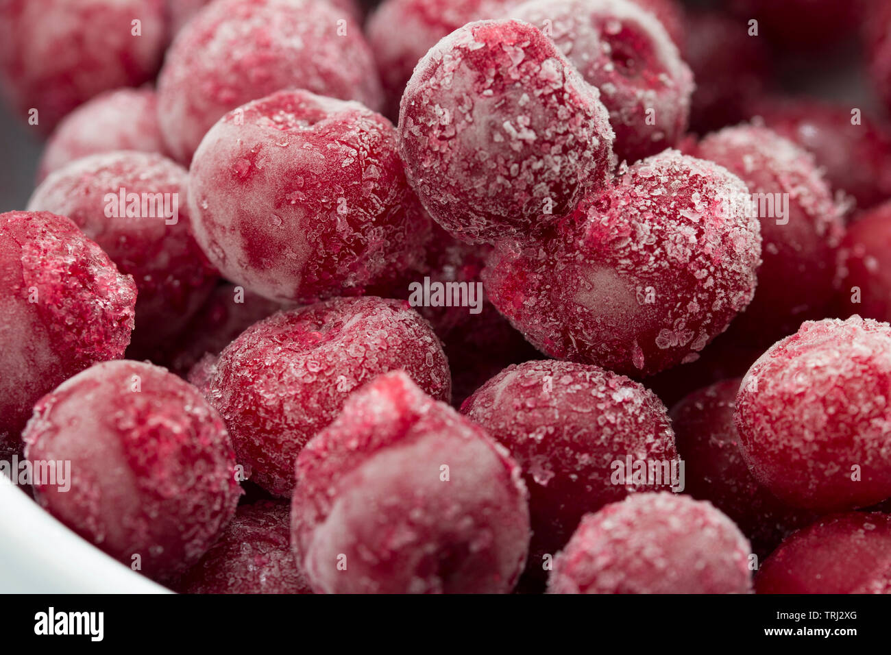 frozen cherry fruit close up . cherry in ice crystals. Fruit product ...