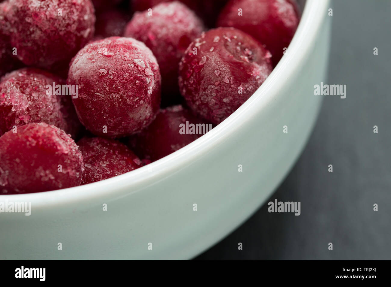 frozen cherry fruit close up . cherry in ice crystals. Fruit product ...