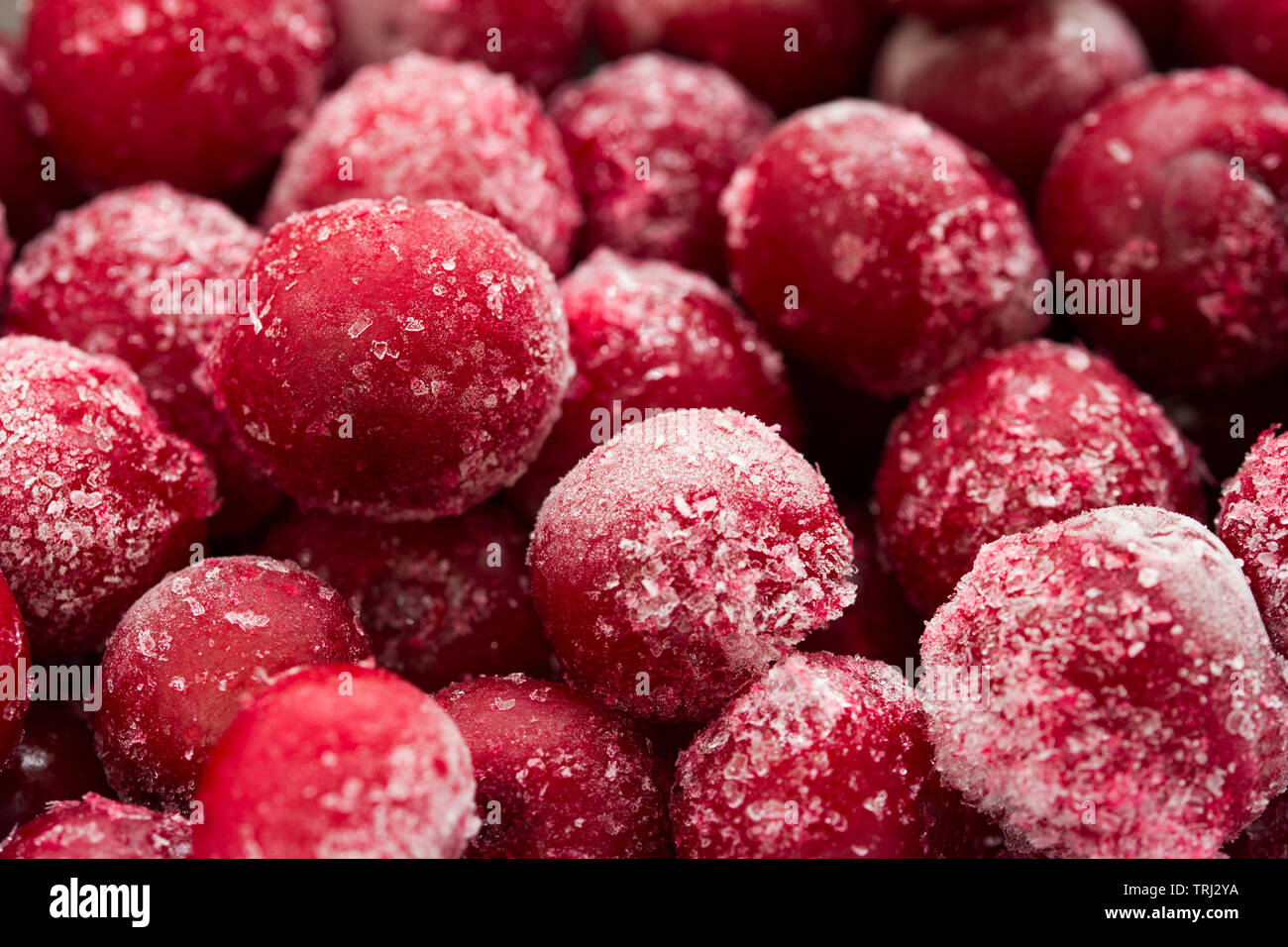 frozen cherry fruit close up . cherry in ice crystals. Fruit product ...