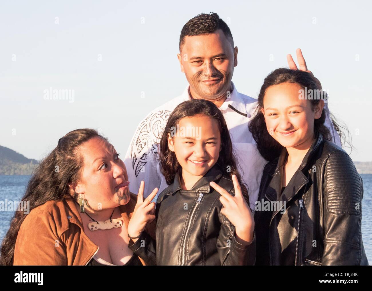 Portrait of a young Maori family taken outdoors Stock Photo - Alamy