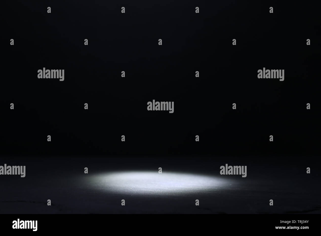 abstract dark concentrate floor scene with mist or fog, spotlight and ...