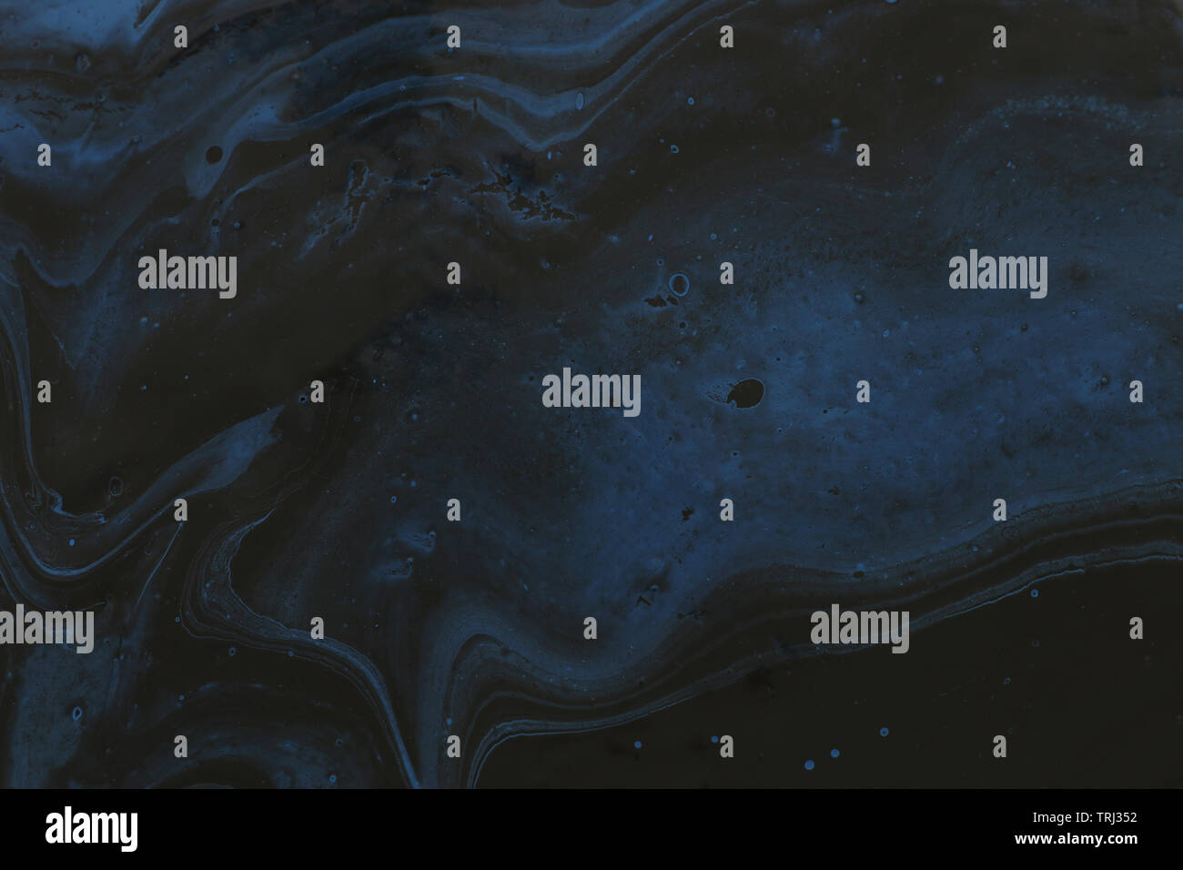 photography of abstract marbleized effect background. Blue and black ...