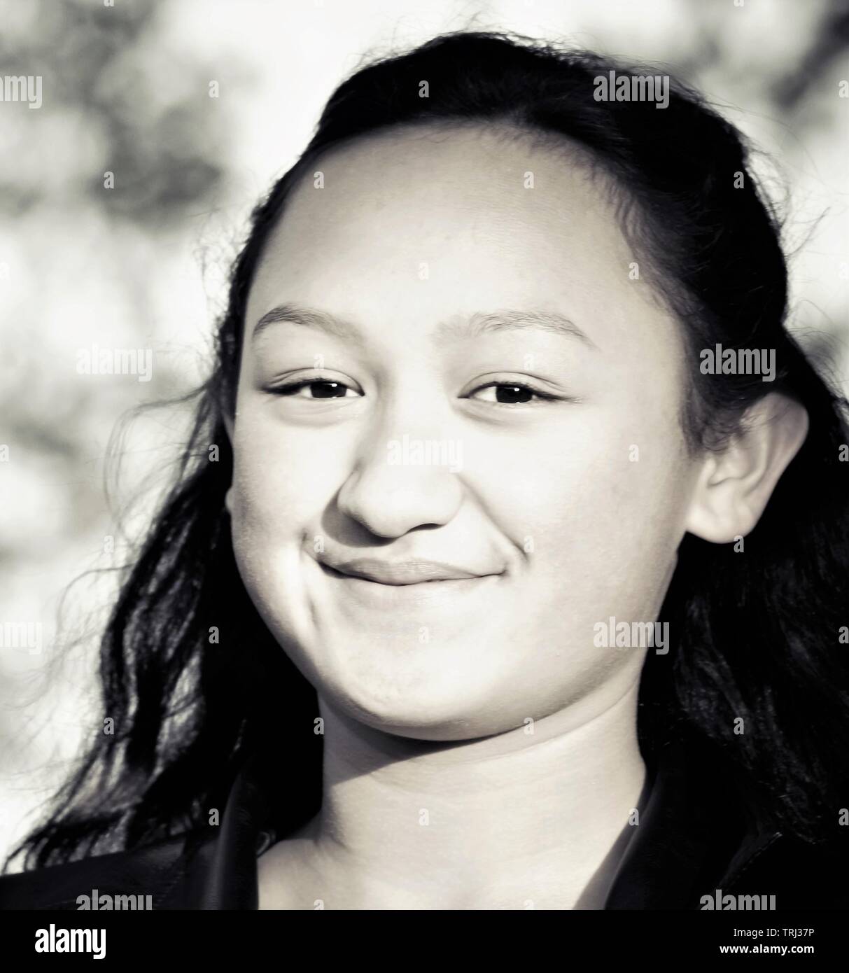 Portrait image of a young Maori girl taken outdoors in a park Stock ...