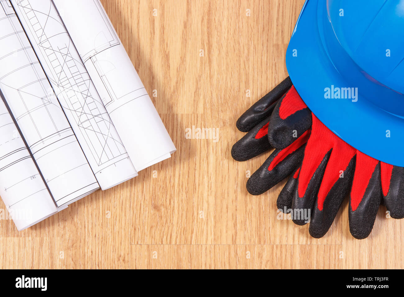 Rolls of diagrams and electrical construction drawings, protective blue ...