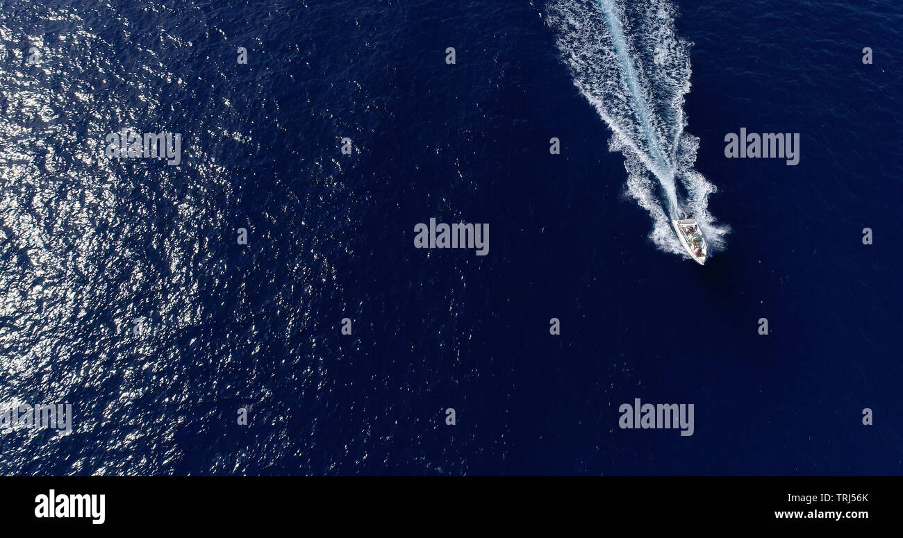 Boat at sea leaving a wake Stock Photo - Alamy