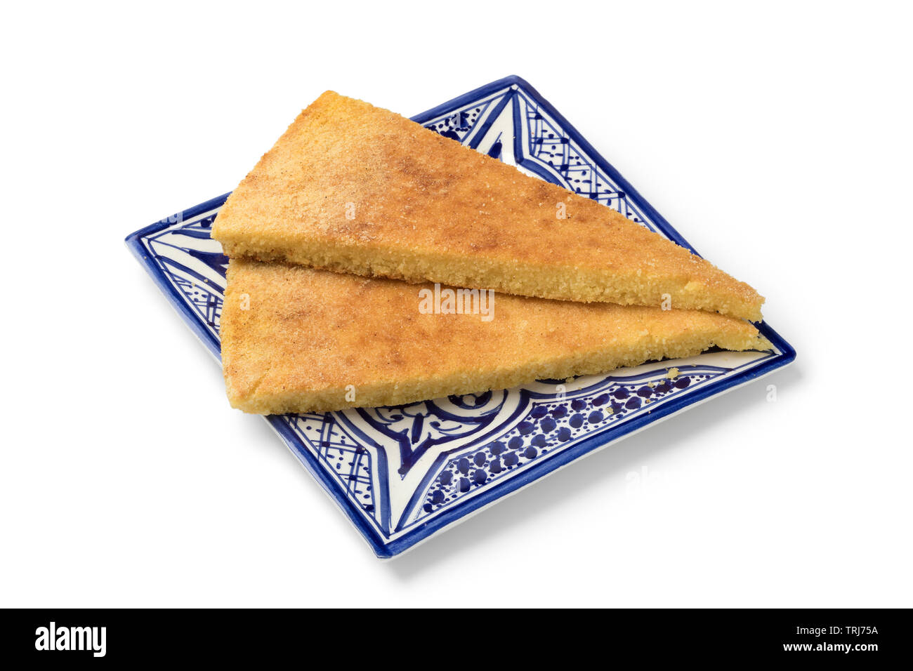 Traditional Moroccan harcha pieces, semolina bread on a plate isolated ...