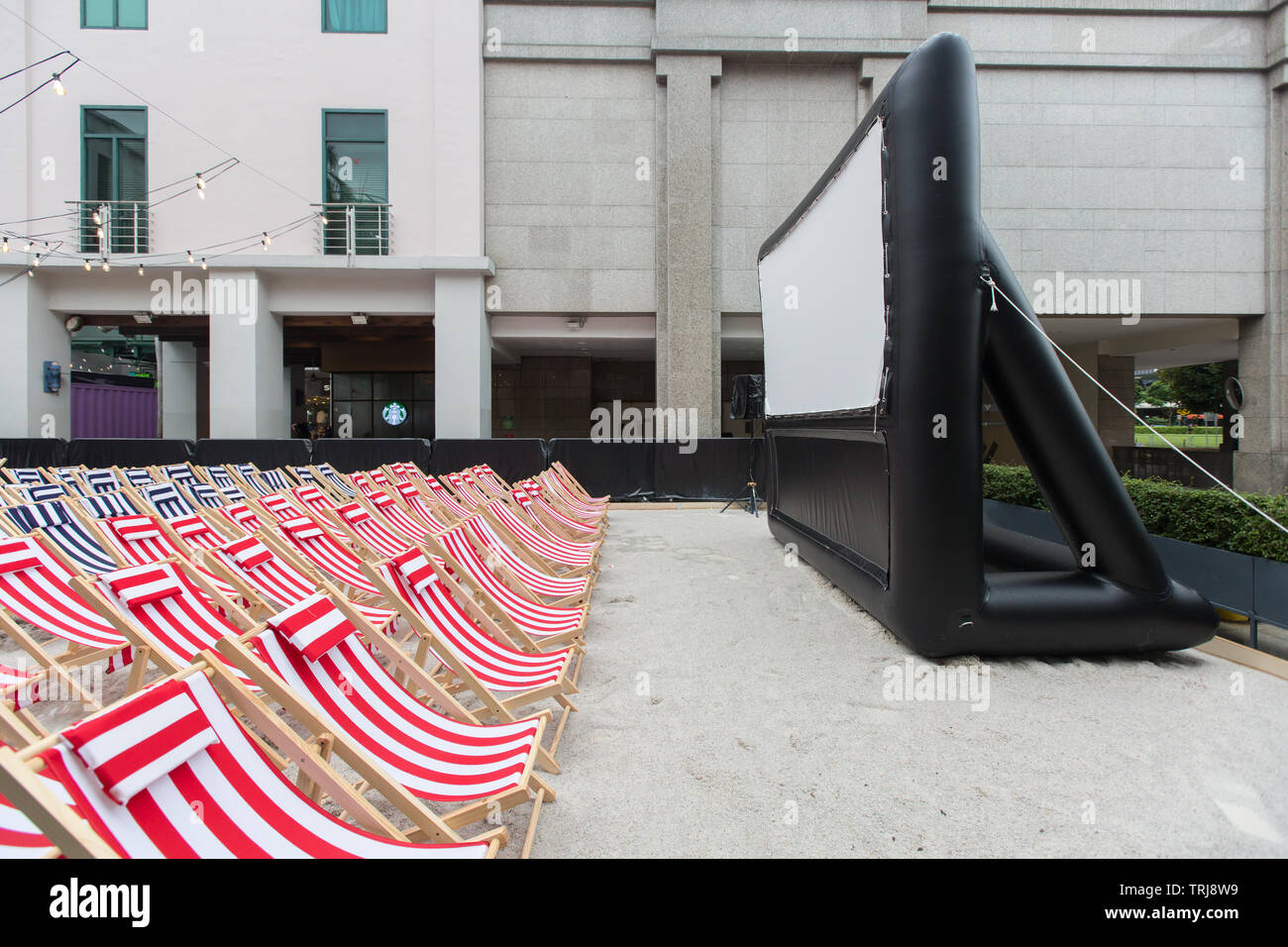 Multiple beach chair used for outdoor movie set-up in urban area Stock ...