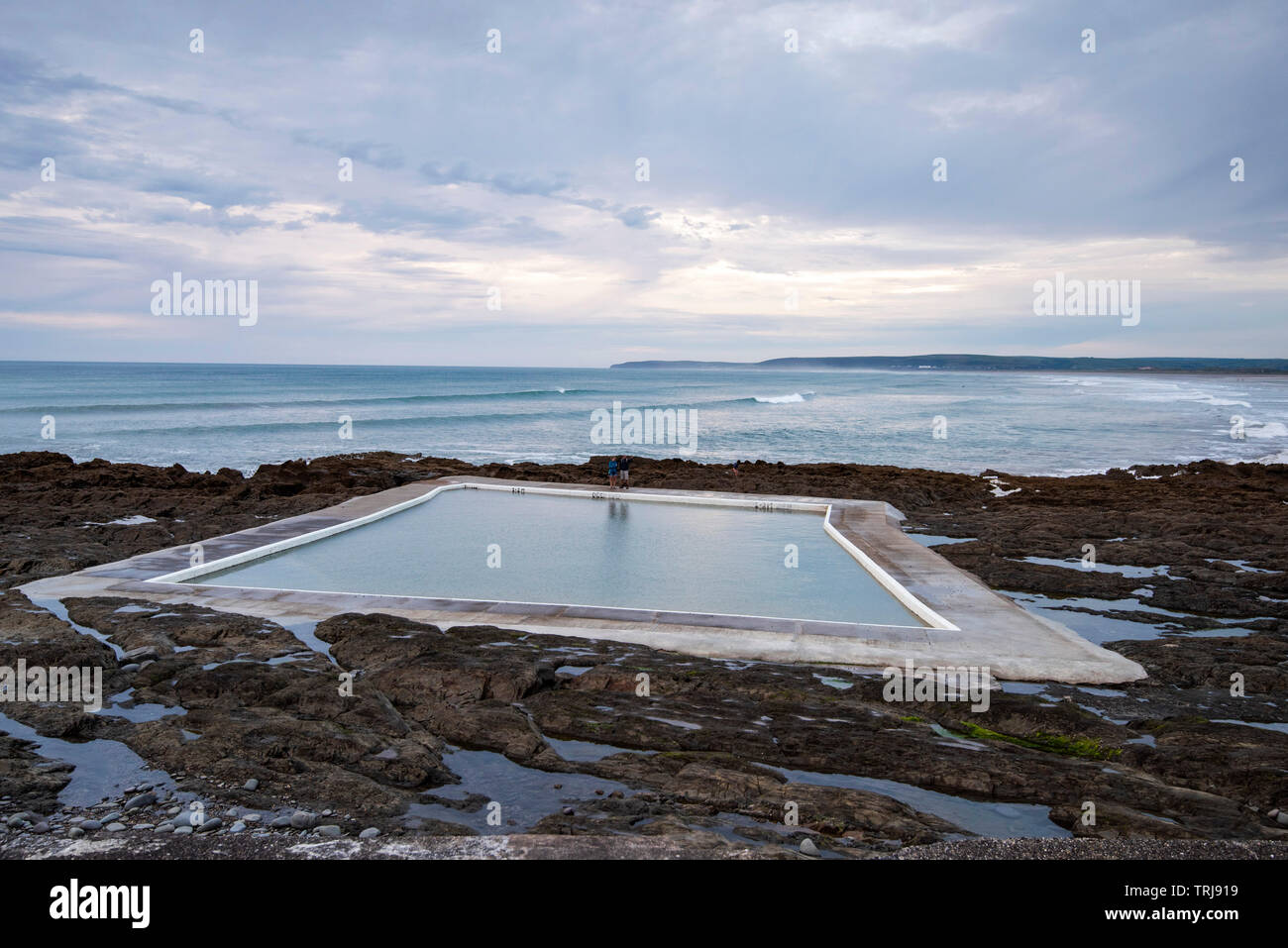 Dusk at the Rock Pool on the seafront at Westward Ho! in Devon England ...