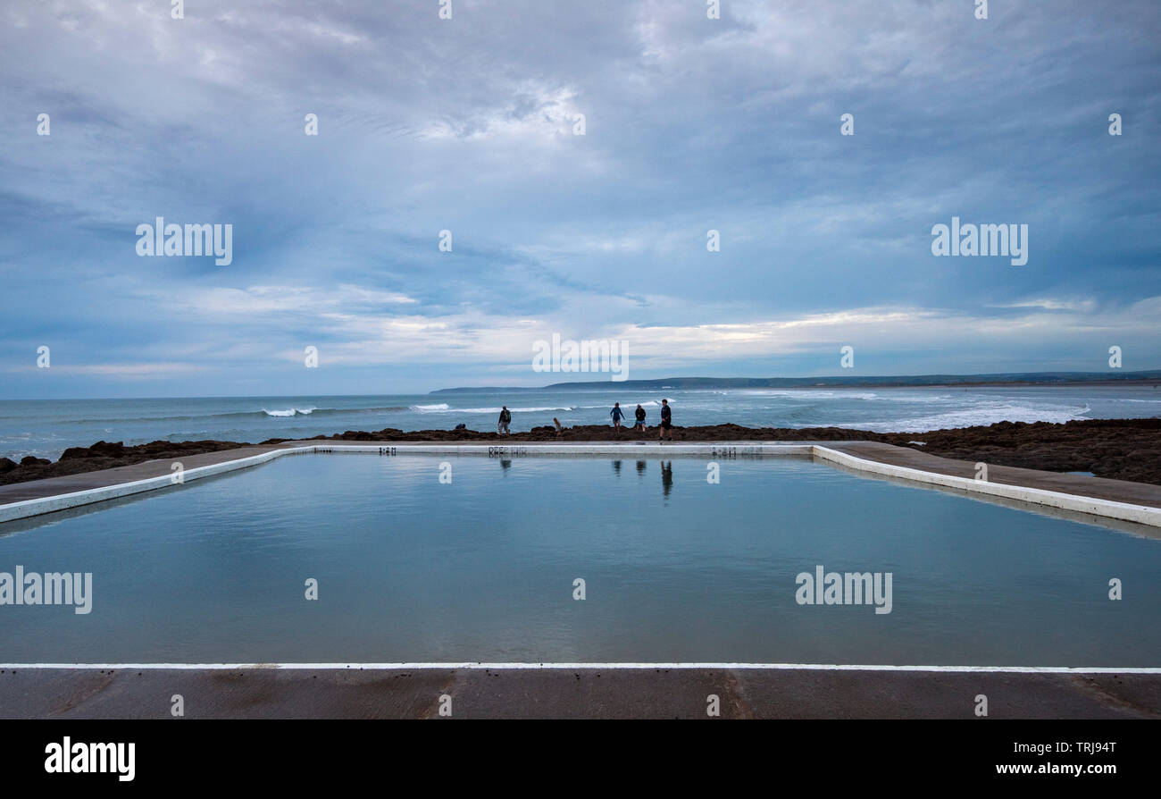 Dusk at the Rock Pool on the seafront at Westward Ho! in Devon England ...