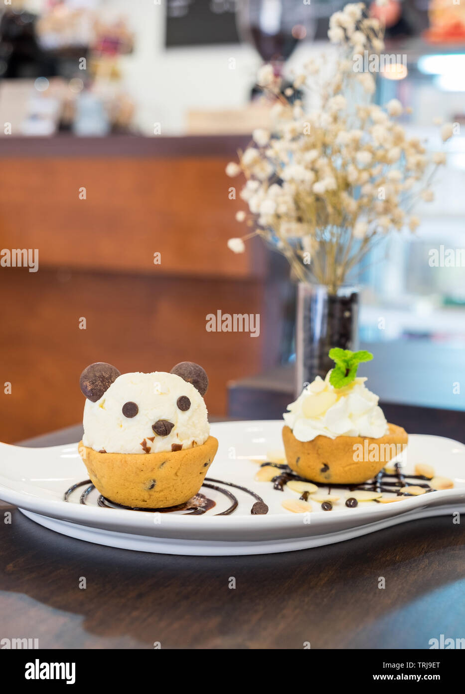Nutella cookie cup ice cream panda on chocolate decor dish Stock Photo ...