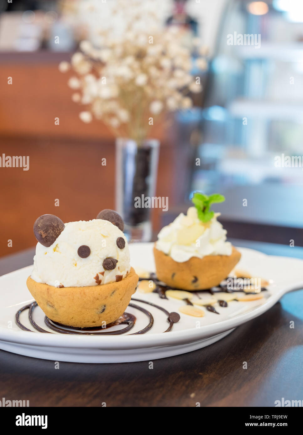 Nutella cookie cup ice cream panda on chocolate decor dish Stock Photo ...