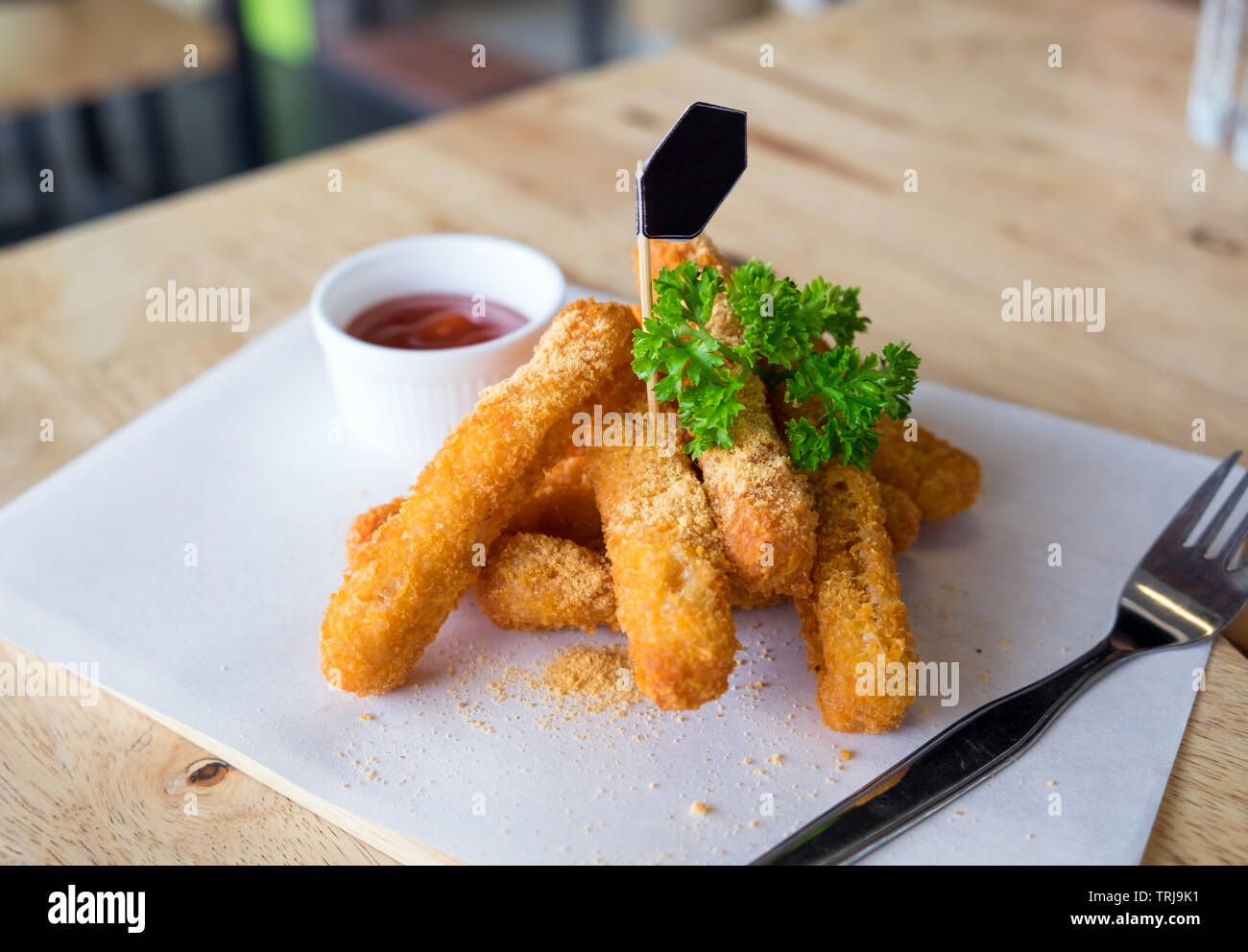 Chicken cheese stick with tomato sauce on white dish Stock Photo - Alamy
