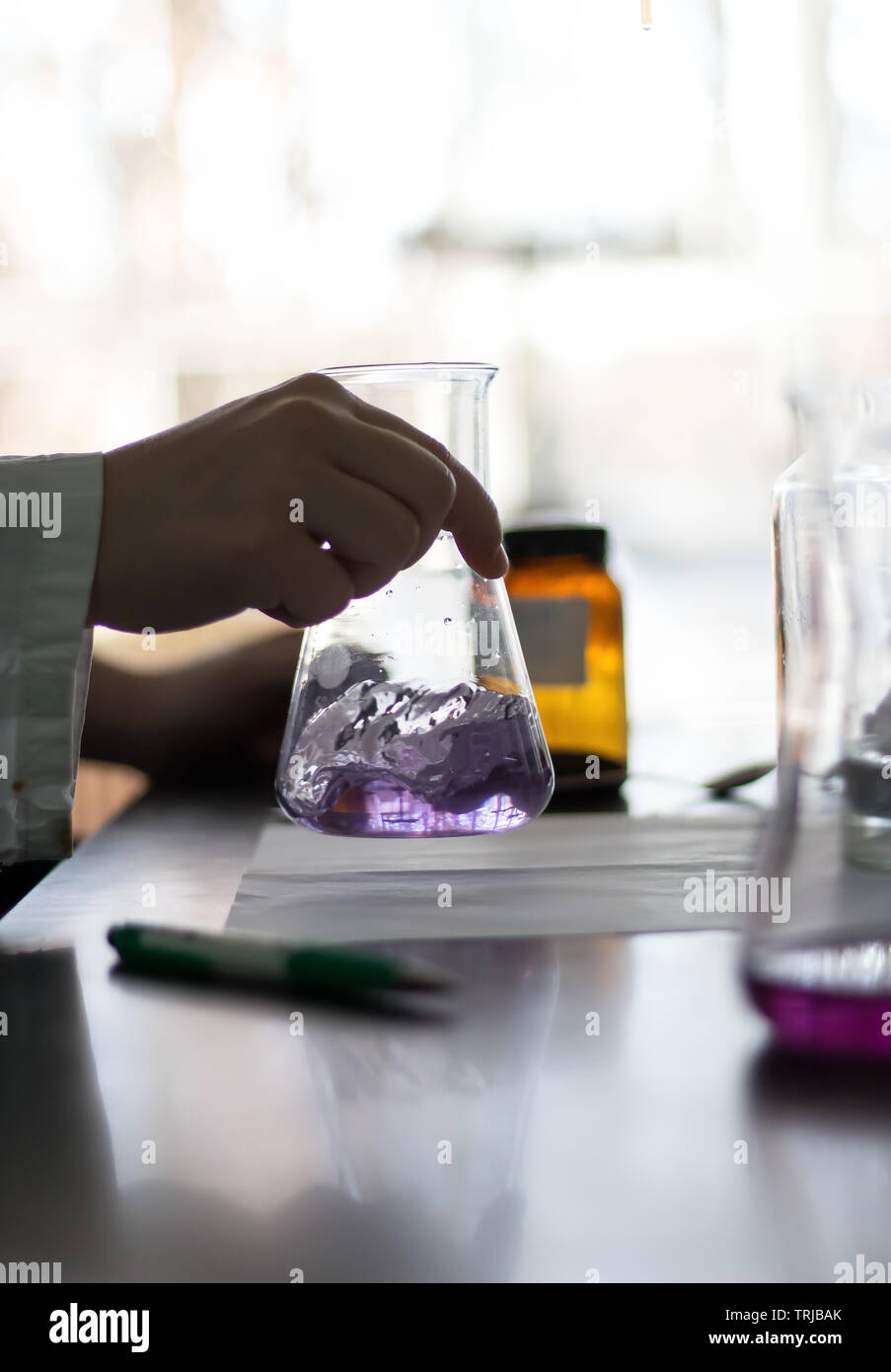Working in a research chemistry biology lab laboratory making ...