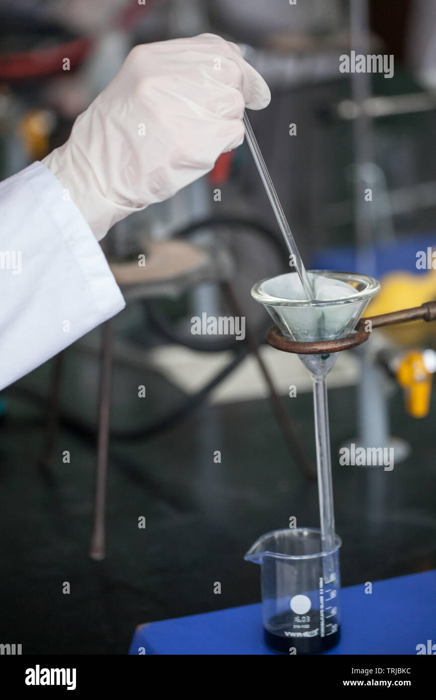 Working in a research chemistry biology lab laboratory making ...