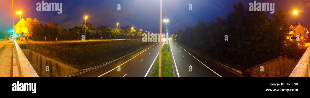 Panorama of an empty highway at night with lights turned on Stock Photo ...