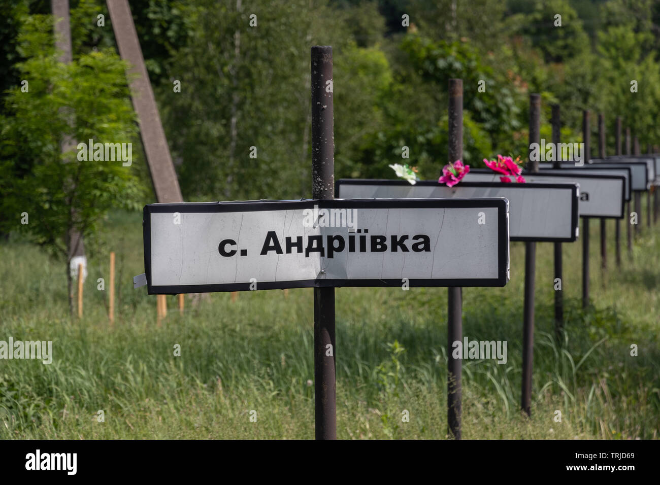 Signs with names of abandoned villages at the monument to the Chernobyl ...