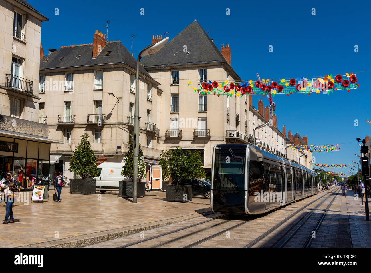 Modern tramway in Tours city centre, shopping street (Rue Nationale) in ...