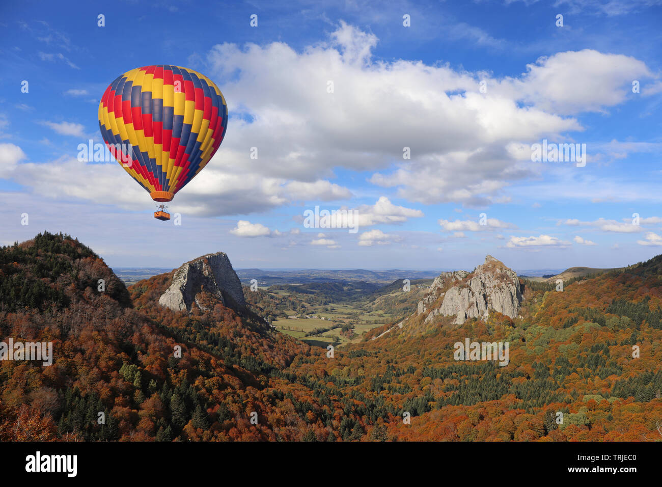 Hot air balloon flying over volcano. Auvergne, France Stock Photo - Alamy
