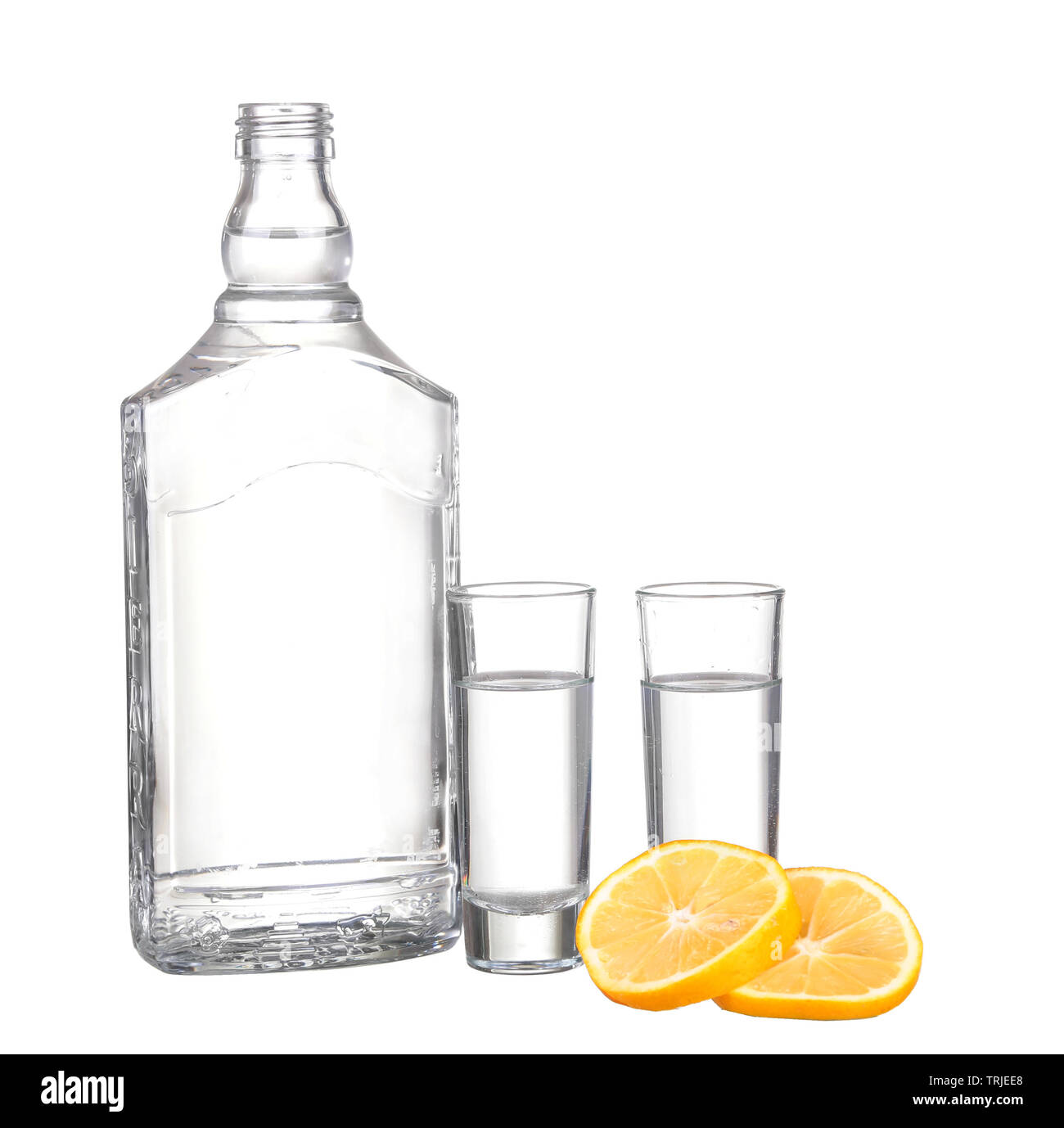 blank label vodka glass and lemon on white background Stock Photo - Alamy