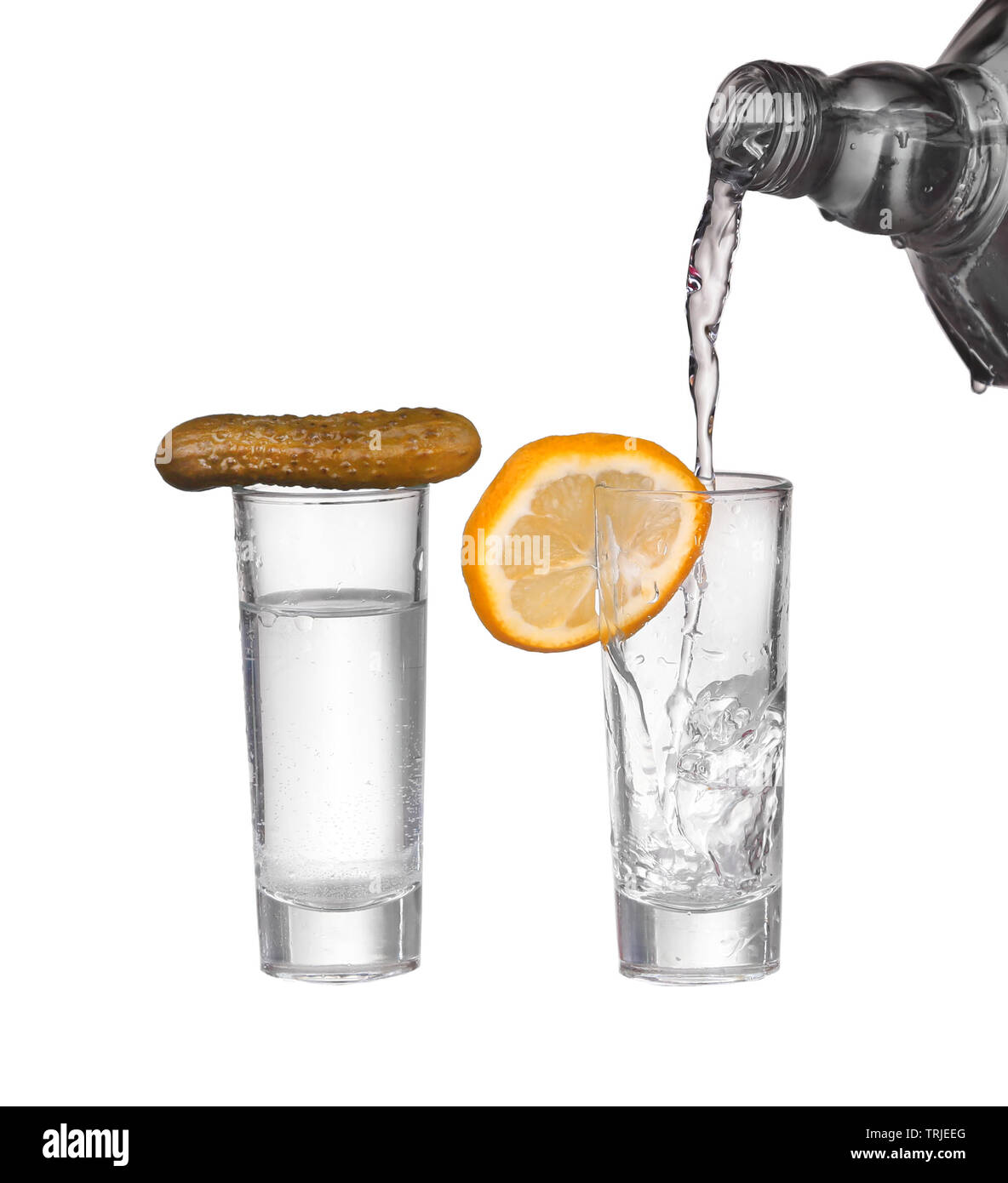 Vodka poured into a glass isolated on white Stock Photo - Alamy