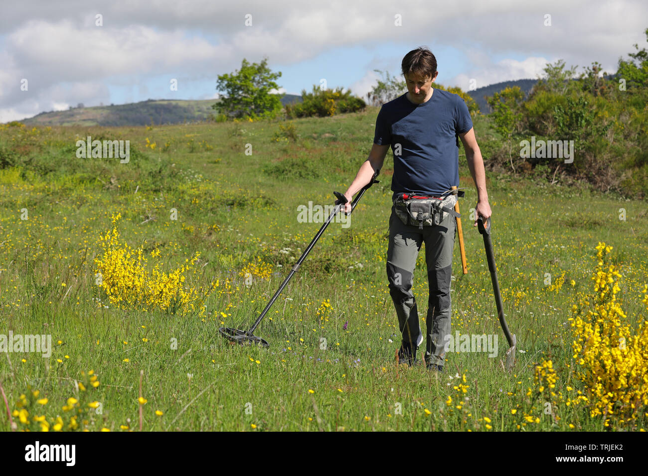 A man searching for buried treasure, ancient coins and historic ...