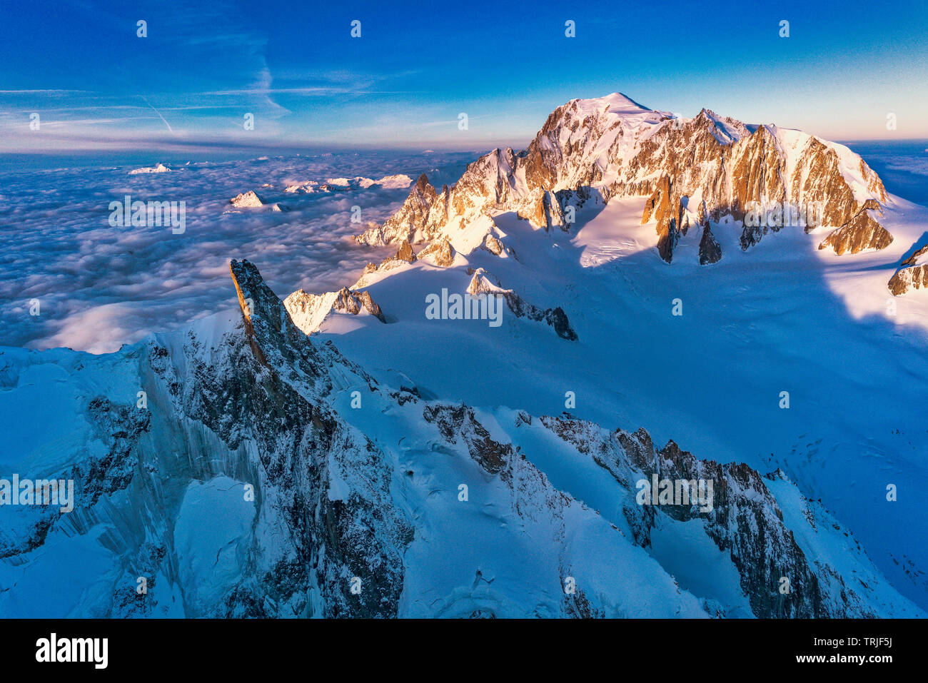Aerial view of Dent du Geant and Mont Blanc covered with snow during ...