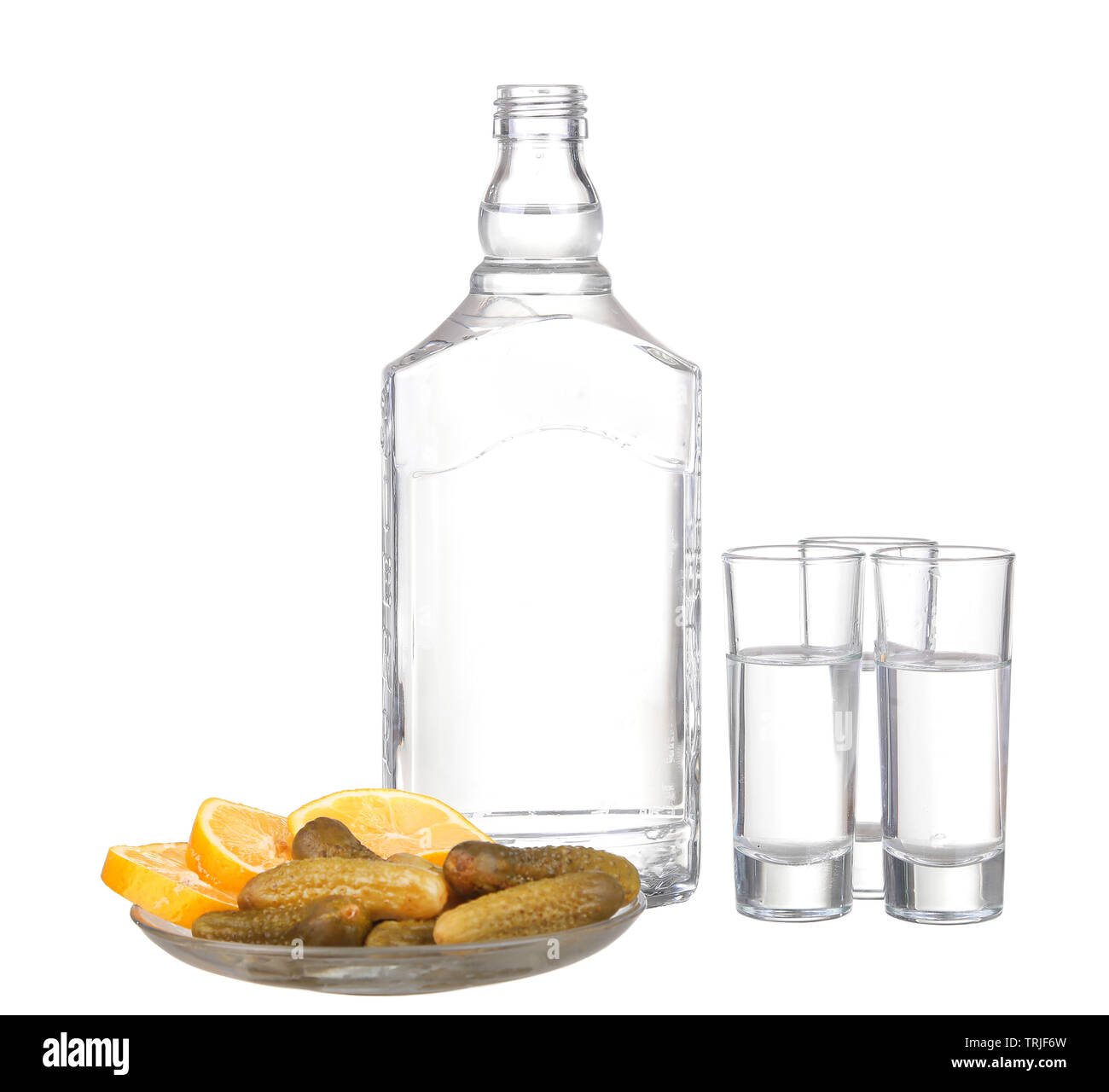 blank label vodka glass and lemon on white background Stock Photo - Alamy