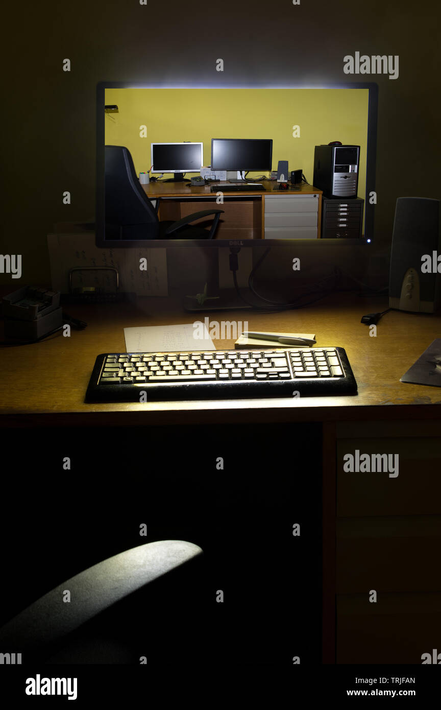 Computer screen illuminated at night Stock Photo - Alamy