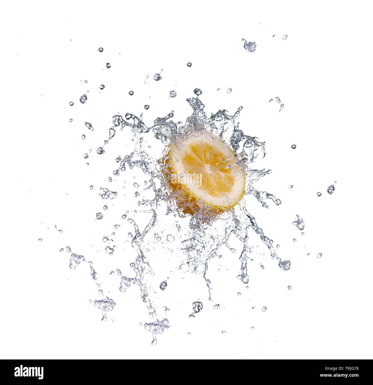 segment of lemon falling in to the water and making splash Stock Photo ...