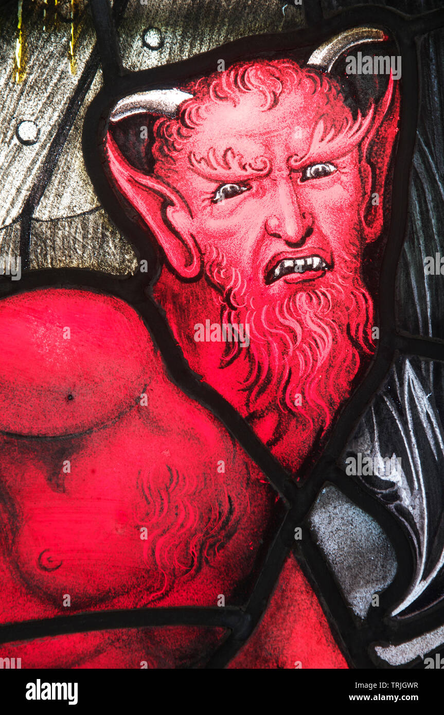 Portrait representing The Devil, in stained glass. Detail of a window ...