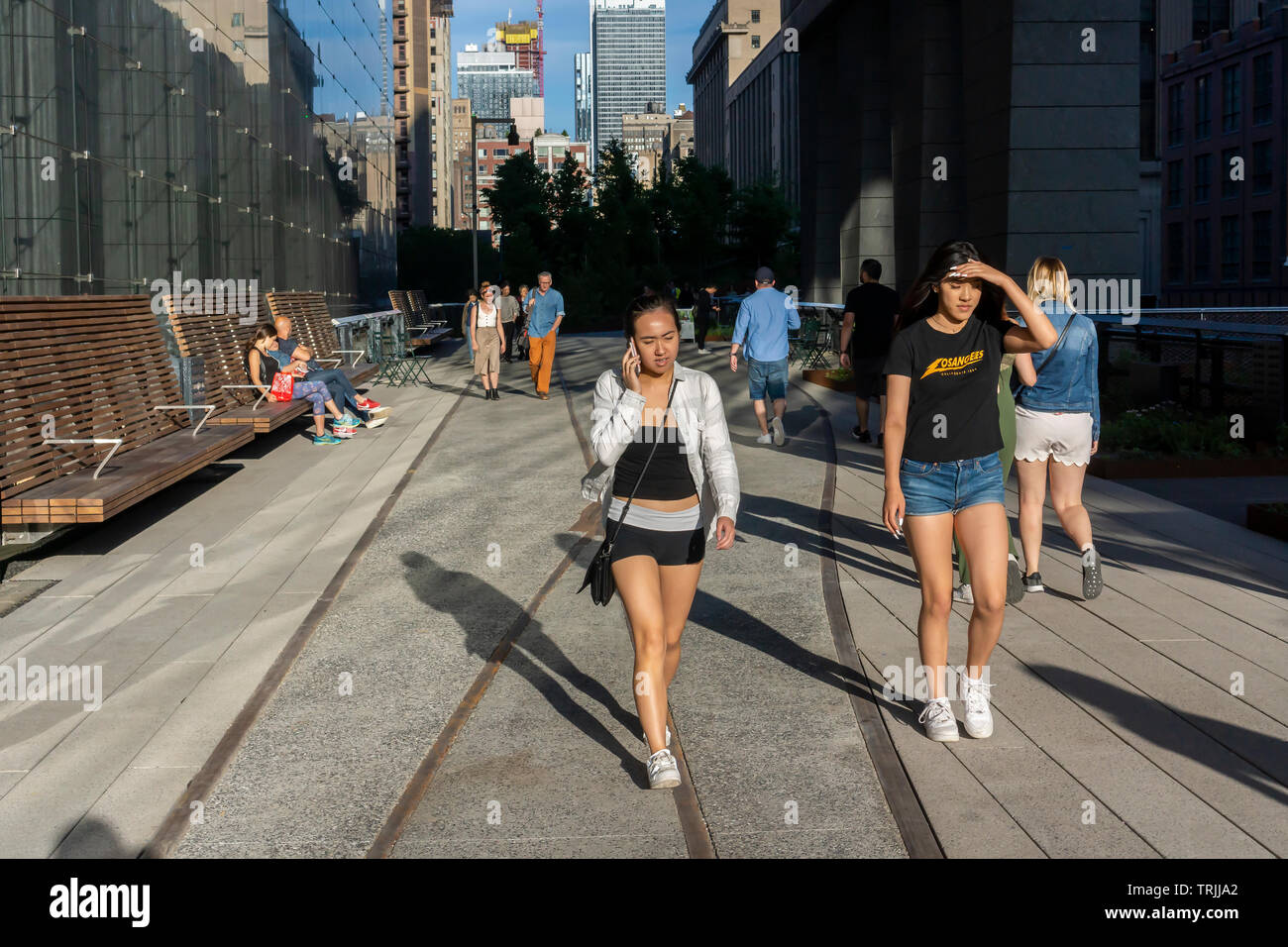 Visitors to the High Line walk through the “Coach Passage” in the newly ...