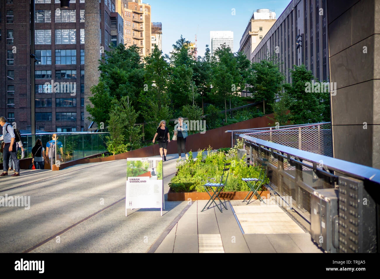 Visitors to the High Line take in the newly opened section “The Spur ...