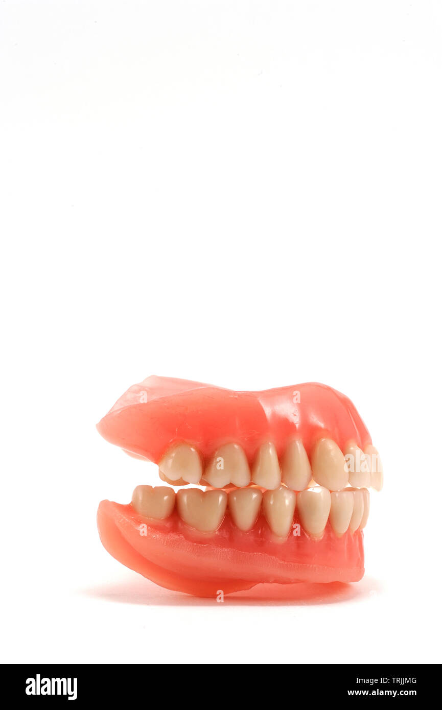 Dentures in profile on a white background Stock Photo - Alamy