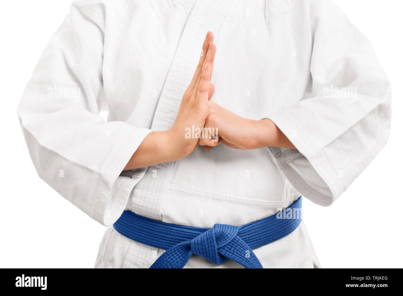 A close up shot of a martial arts fighter in a white kimono with blue ...