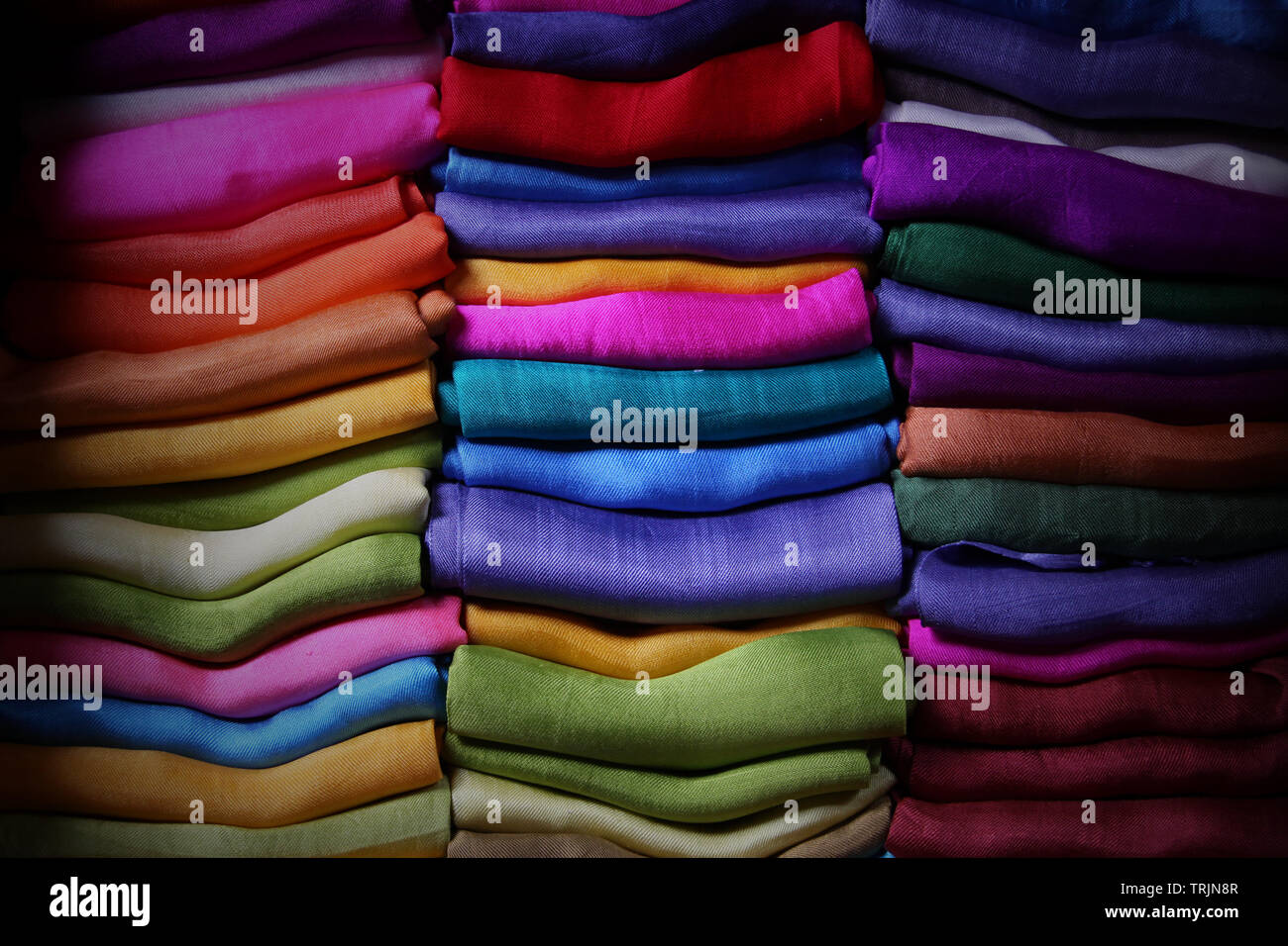 Stack of colourful fabrics Stock Photo - Alamy