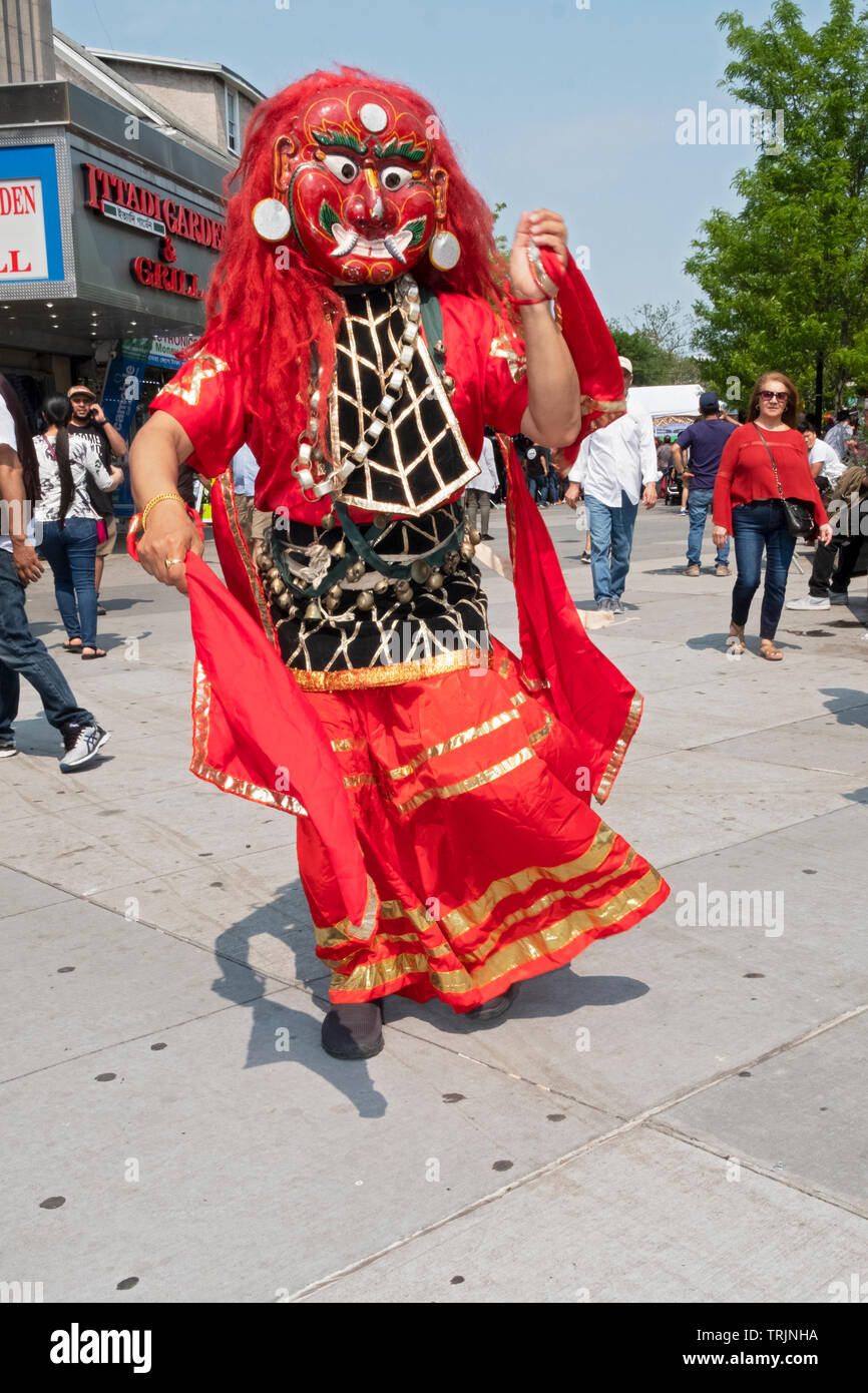 A Nepalese man in a traditional Himalayan Lakhey mask dances in ...