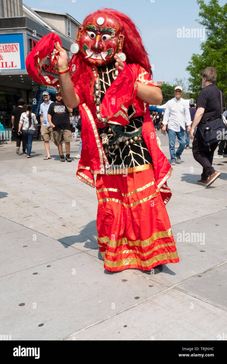 A Nepalese man in a traditional Himalayan Lakhey mask dances in ...