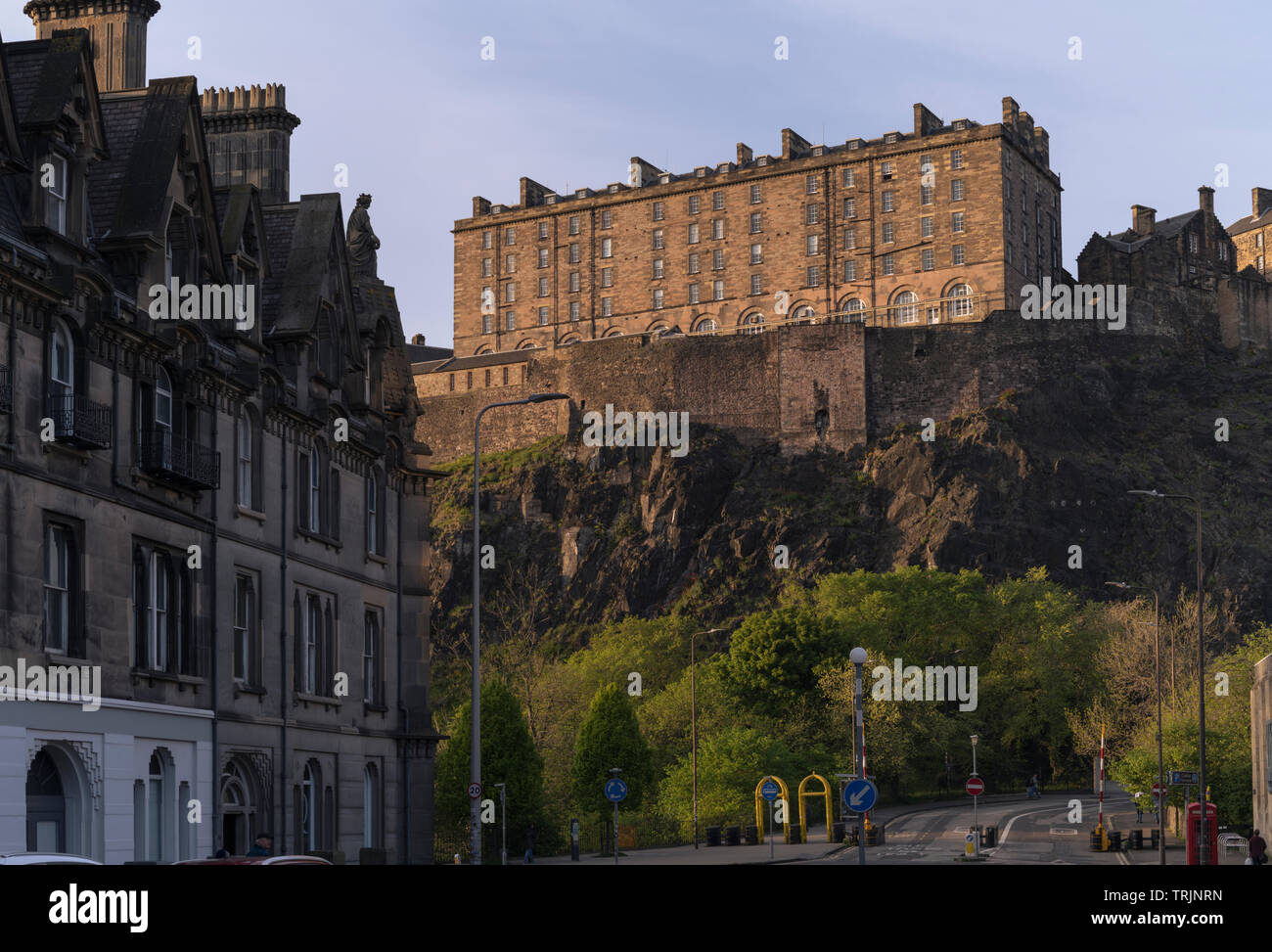 Edinburgh castle towers over the buildings on Castle Terrace in the ...