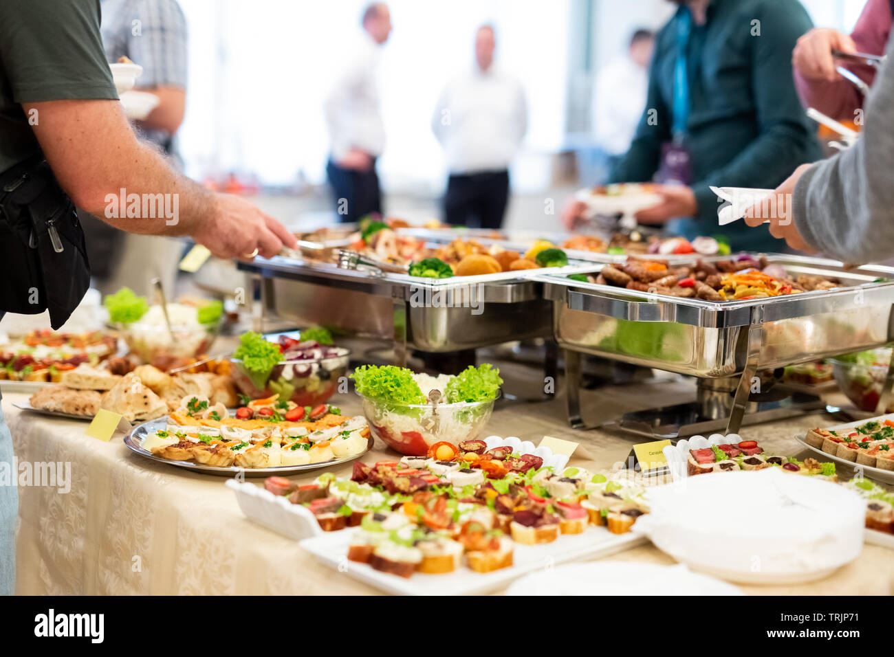 People enjoying buffet meal Stock Photo - Alamy