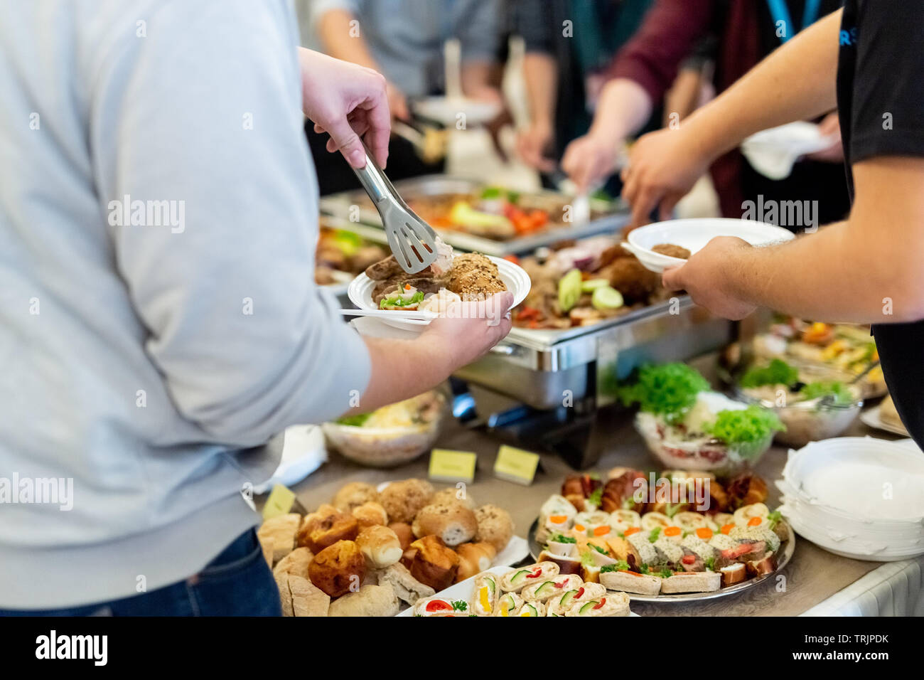 People serving themselves buffet hi-res stock photography and images ...