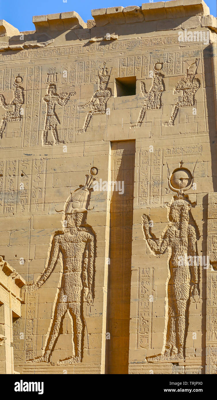 Wall decorations and hieroglyphics of the gods Ra, Osiris and Horus in ...