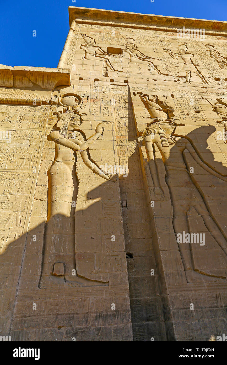 Wall decorations and hieroglyphics of the gods Ra, Osiris and Horus in ...