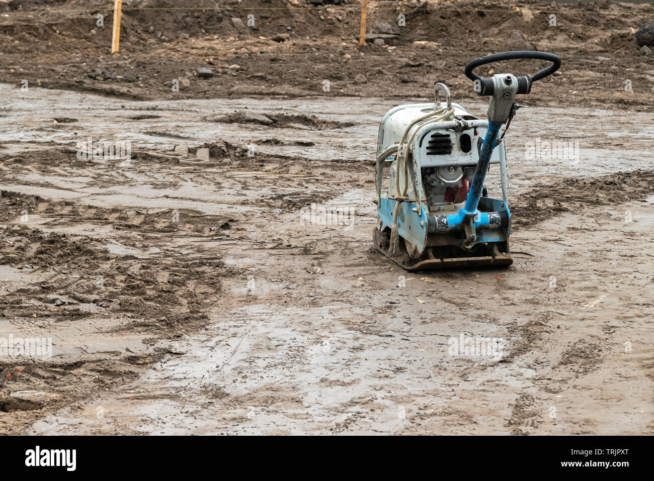Plate compactor on the ground at construction site. Vibratory hammer ...