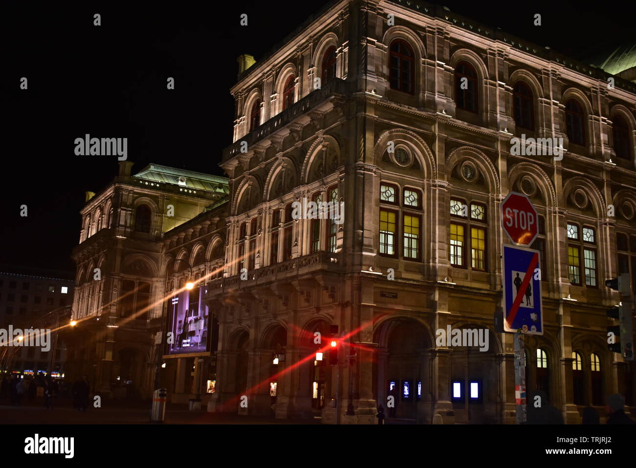 perspective view of the Vienna State Opera house during a rainy night ...