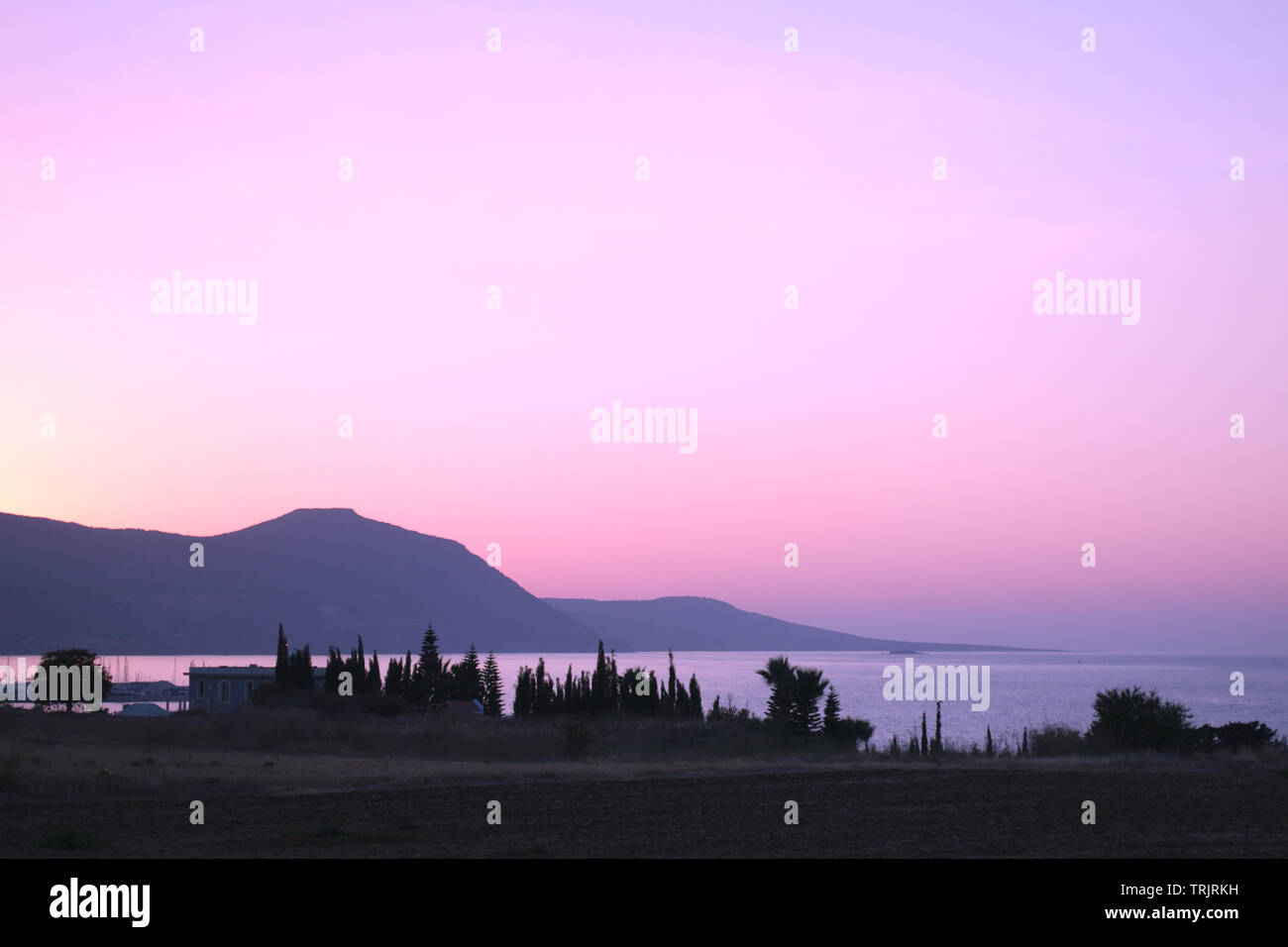 Purple sunset over the mountains and sea. Cyprus Stock Photo - Alamy