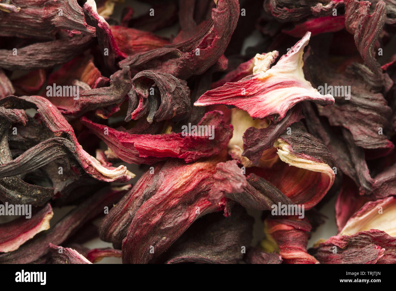 Dry carcade tea, creative texture background, red flowers of hibiscus ...