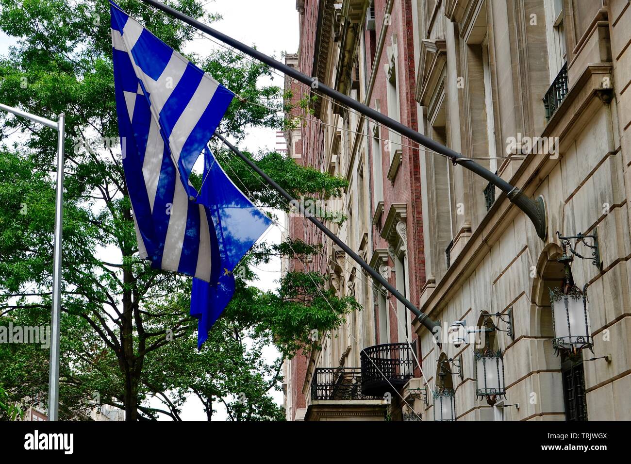 European Union and Greek flags fly outside the offices of the Consulate ...