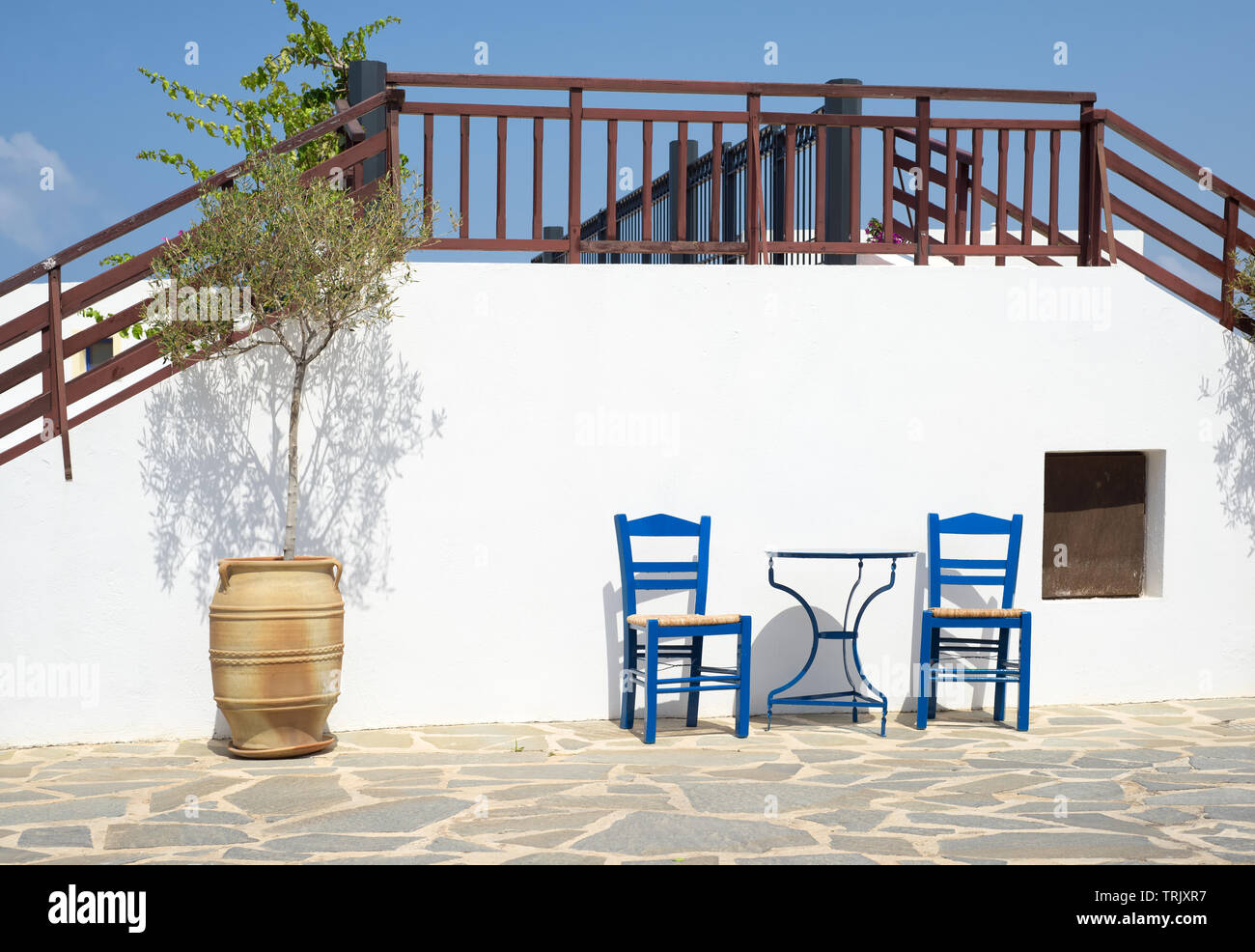 Greek style blue table chairs hi-res stock photography and images - Alamy