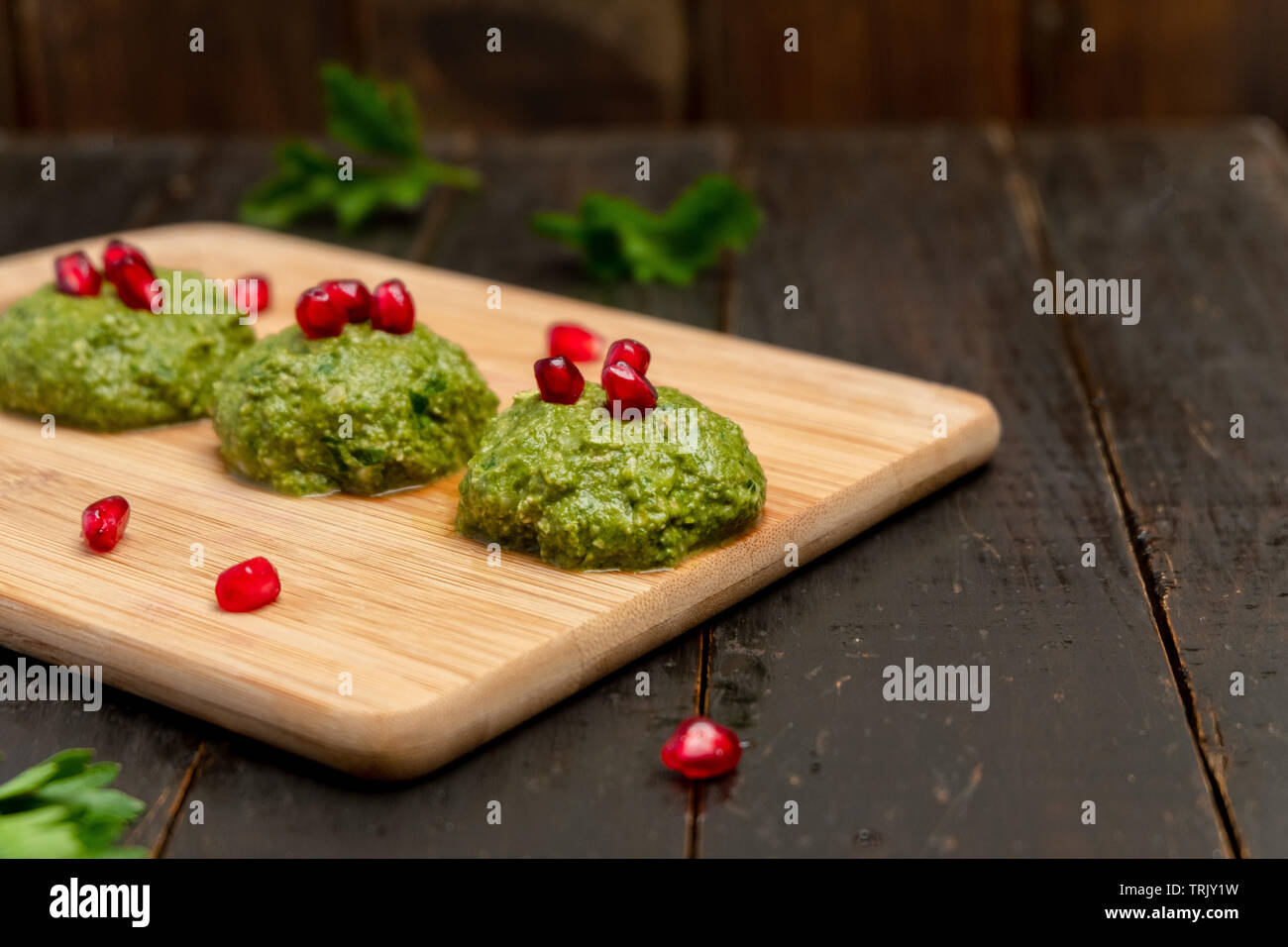Spinach balls called Pkhali, traditional Georgian cuisine, on wooden ...