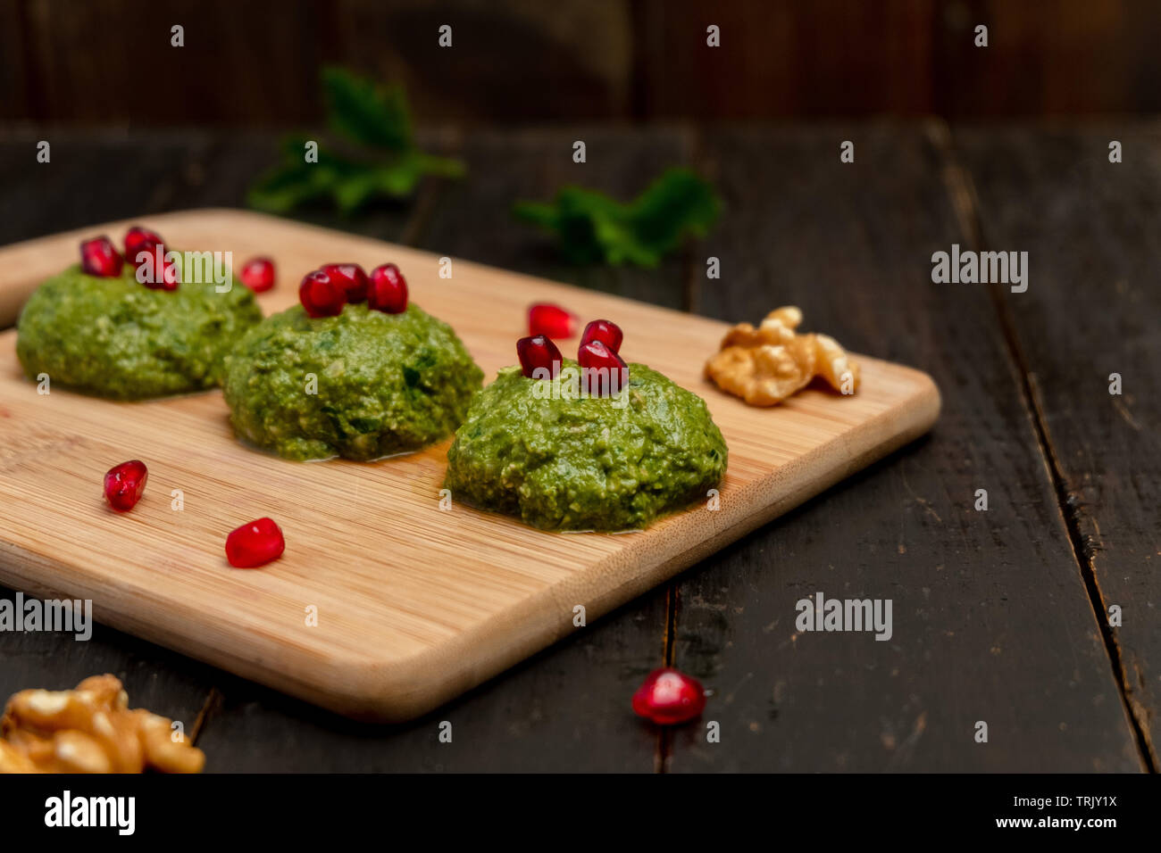 Spinach balls called Pkhali, traditional Georgian cuisine, on wooden ...